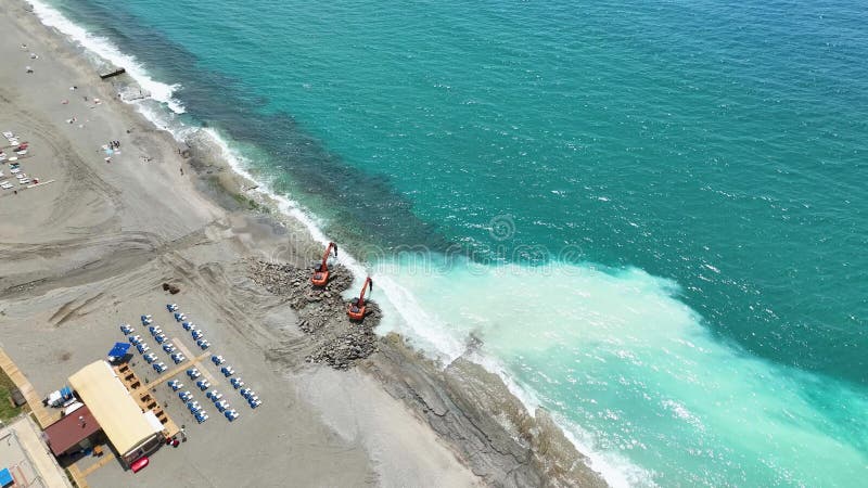 Waves of Progress: Aerial View of Beach Construction with Breakers ...