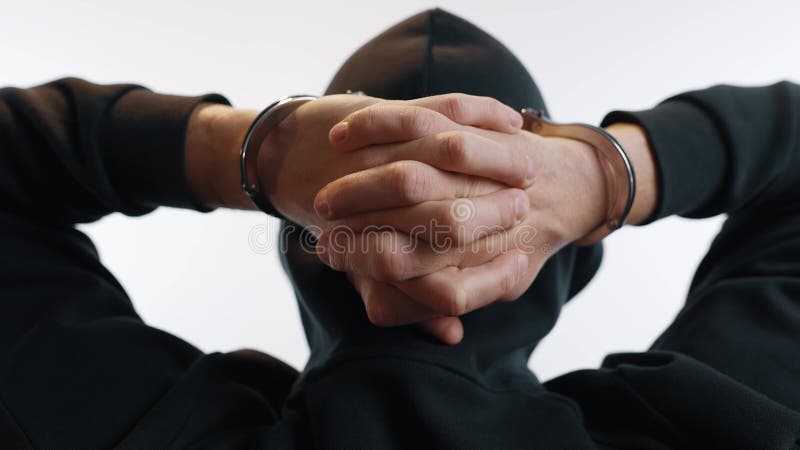 Handcuffed Man Clasping Hands Behind Lowered Head Stock Video - Video ...