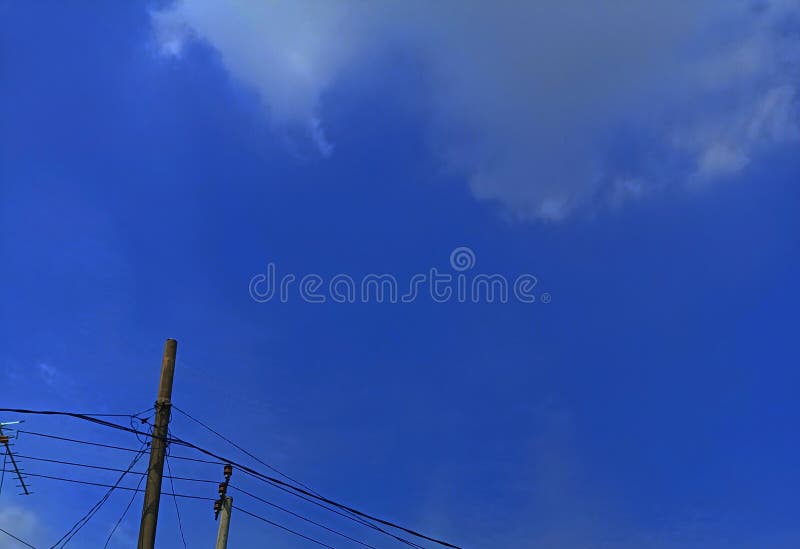 Capturing Electric Poles with a Bright Blue Sky Background Stock Image ...