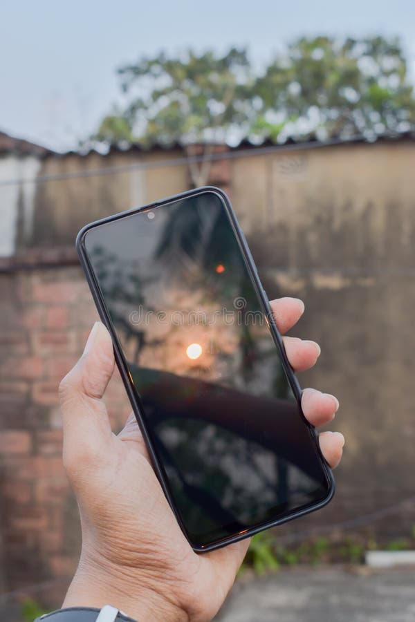 Capturing Sunset in Mobile Phone. Smartphone Device Screen Showing ...