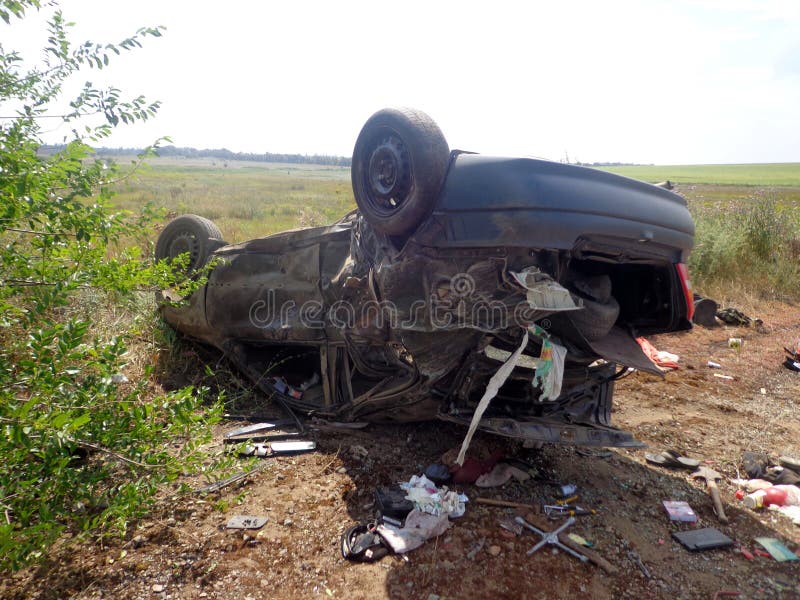 Car Accident. Broken Turned Over Car Lies Near Road Stock Image - Image ...