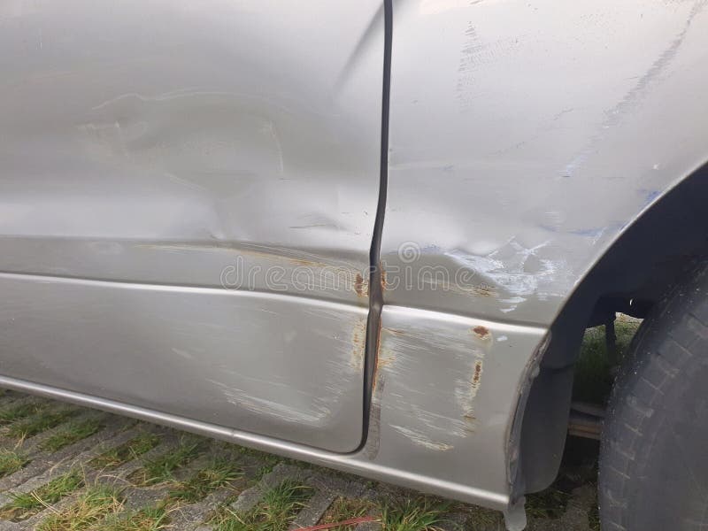 Accident Damage on Side of Gray Car in Parking Lot Stock Image - Image ...