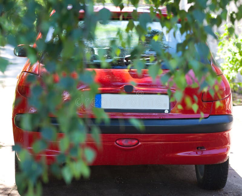 Car behind tree leaves stock image. Image of branches - 20165845