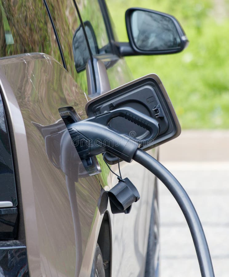 A Car is Being Charged at a Charging Station Stock Photo - Image of ...