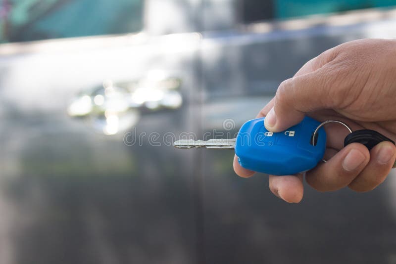 Car blue keys in hand stock photo. Image of vehicle - 127582396