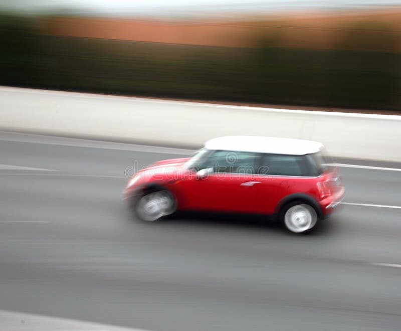 Speeding car (Mini Cooper) stock image. Image of commuting - 14508305