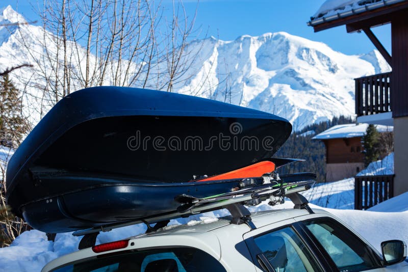 Car Box on the Roof with Ski Inside Over Mountain Peaks Stock Photo ...