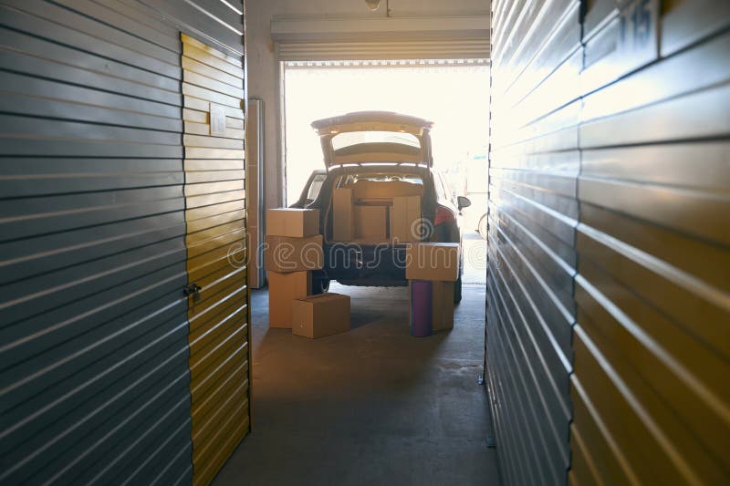Car with Boxes in the Trunk is in the Storage Service Stock Image ...