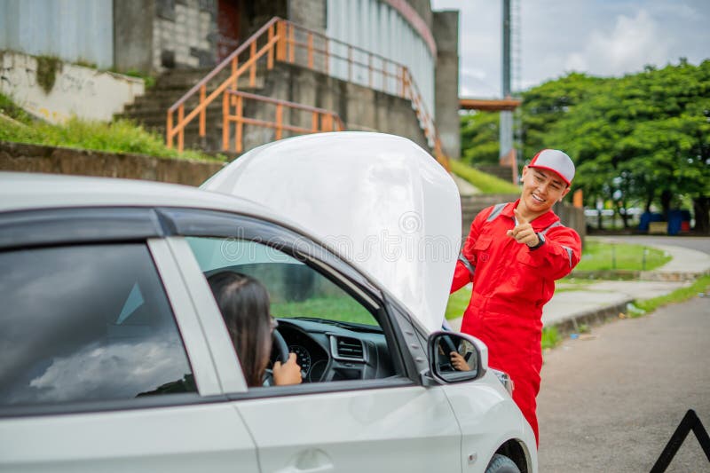 Car Breakdown Assistance: Mechanic Helping Driver with Engine Troubles ...