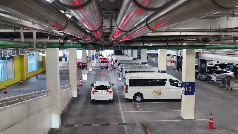 A Car Carefully Navigating through a Parking Area that is Marked with ...