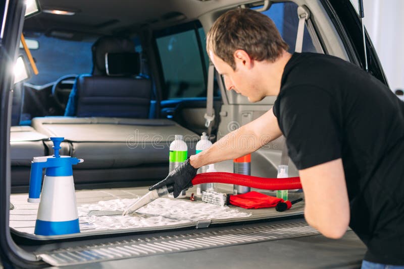 Car Chemist. Chemical Treatment of the Car Trunk. Stock Photo - Image ...