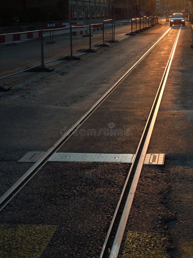 Car Driving on Rails with Sun Backlight Stock Photo - Image of tracks ...