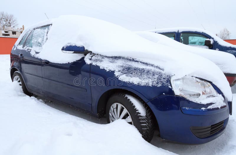 Car covered by heavy snow stock image. Image of person - 28690477