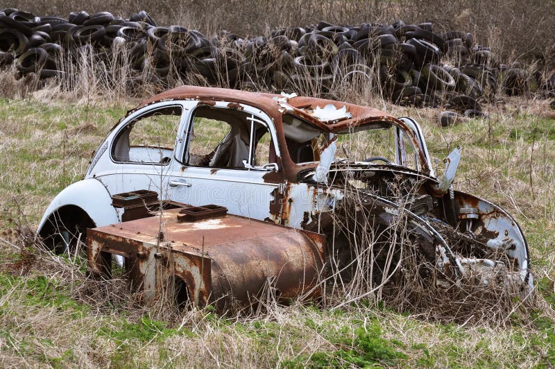 A Junk Car and Other Scraps Piled on the Side of the Road Editorial ...