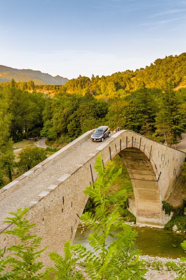 Car Crossing Hunchback Bridge Stock Image - Image of heritage, couple ...