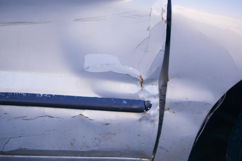 Car Damage with Visible Scratches and Dents on the Door Panel Stock ...