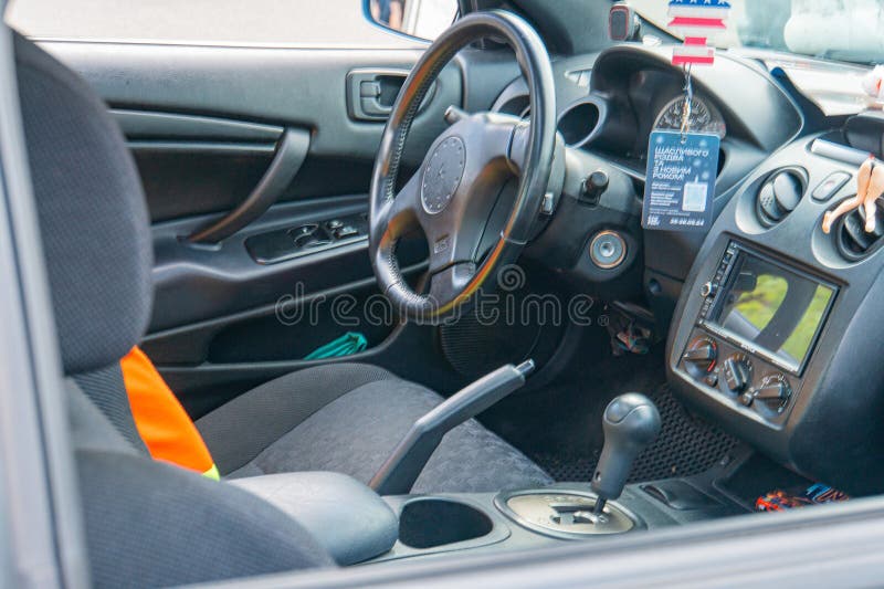 A Car Dashboard Dominates a Still, Parked Vehicle from the Passenger ...