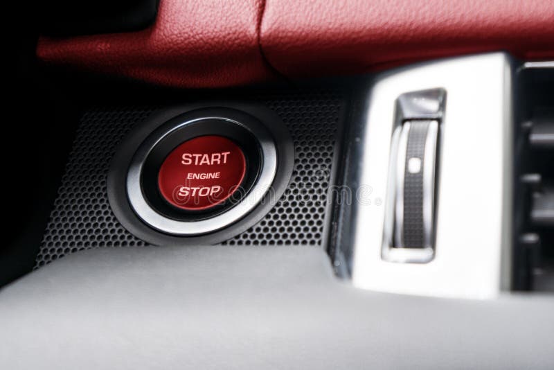 Car Dashboard with Focus on Red Engine Start Stop Button. Modern Car ...