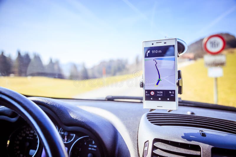 Car Dashboard with Smartphone Used As Navigation Device, Bright and ...