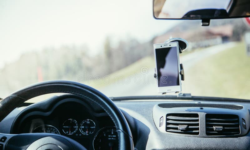 Car Dashboard with Smartphone Used As Navigation Device, Bright and ...