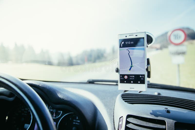 Car Dashboard with Smartphone Used As Navigation Device, Bright and ...