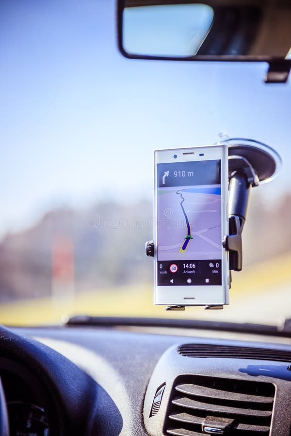 Car Dashboard with Smartphone Used As Navigation Device, Bright and ...