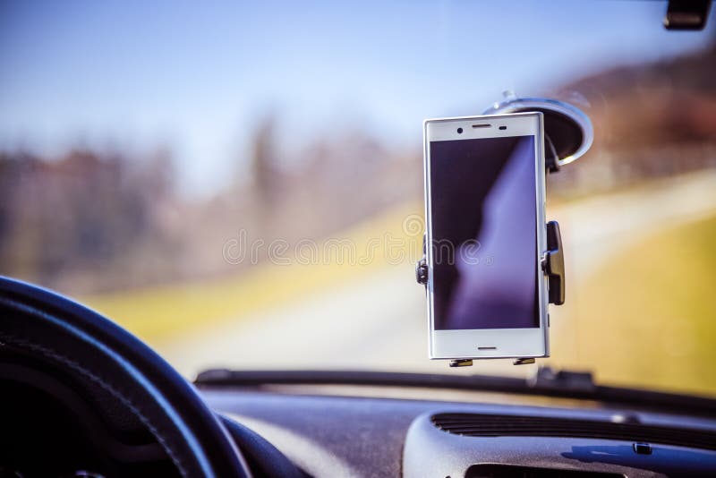 Car Dashboard with Smartphone Used As Navigation Device, Bright and ...