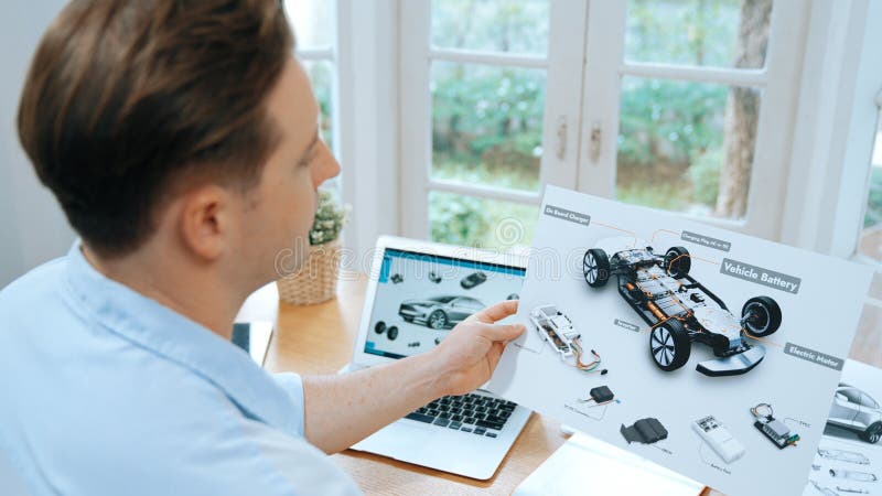 Car Designer Carefully Analyzing Car Prototype. Synchronos Stock Photo ...