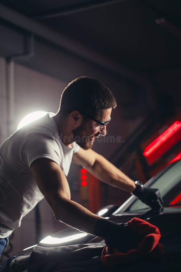 Car Detailing - the Man Holds the Microfiber in Hand and Polishes the ...