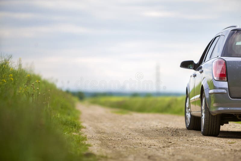 A Car on Dirt Road in Green Field Stock Image - Image of land ...