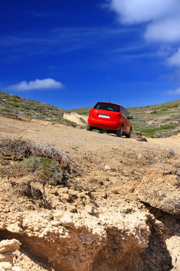 The Car On A Remote And Dirt Road On A Mountain Slope. Stock Photo ...