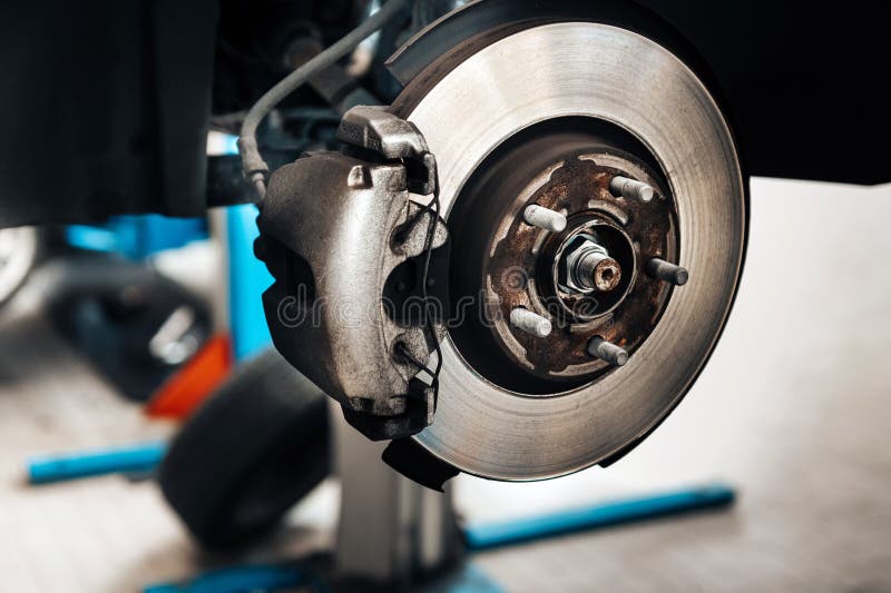 Car Disk Brake Being Repaired in a Workshop Stock Image - Image of ...