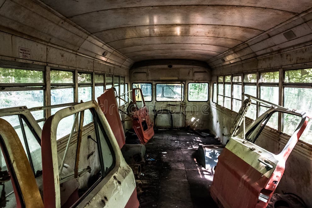 Car Doors Inside of a Old School Bus in a Junkyard Stock Photo - Image ...