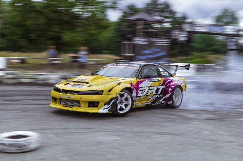 Car Drifts on a Race Track, Emitting Smoke Editorial Photo - Image of ...