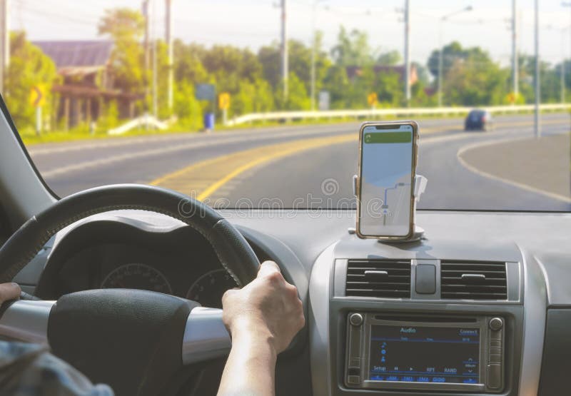 Car Driver Using Smartphone with GPS Map Navigation Application while ...