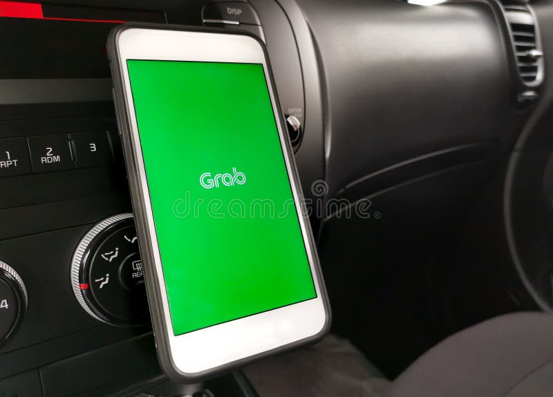 Car Driver Using Smartphone with with Grab App on Dashboard. Editorial ...