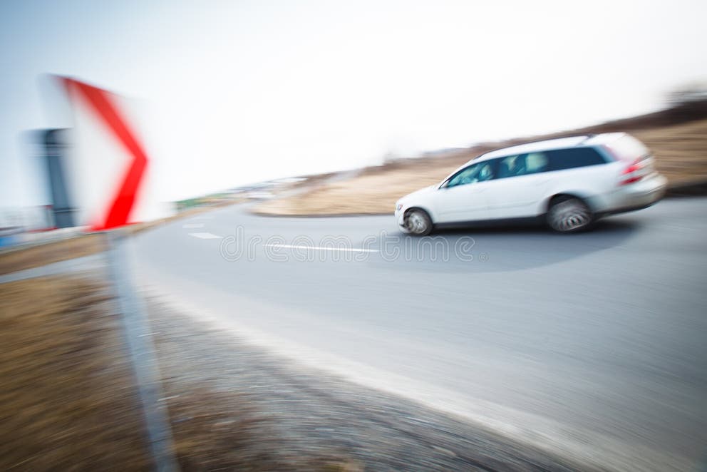 Car Driving Fast through a Sharp Turn Stock Photo - Image of driving ...