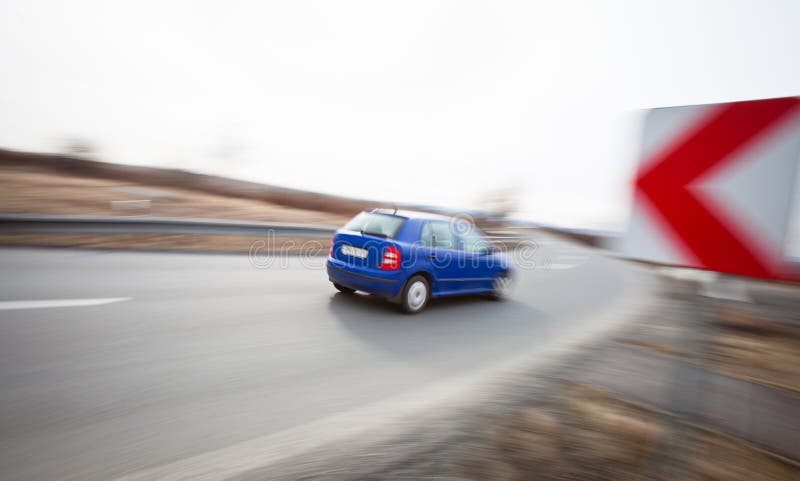 Car Driving Fast through a Sharp Turn Stock Photo - Image of driveway ...