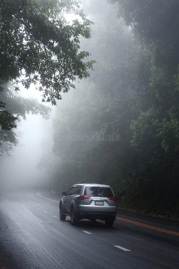 Car Driving through the Fog Stock Image - Image of road, drive: 140540119