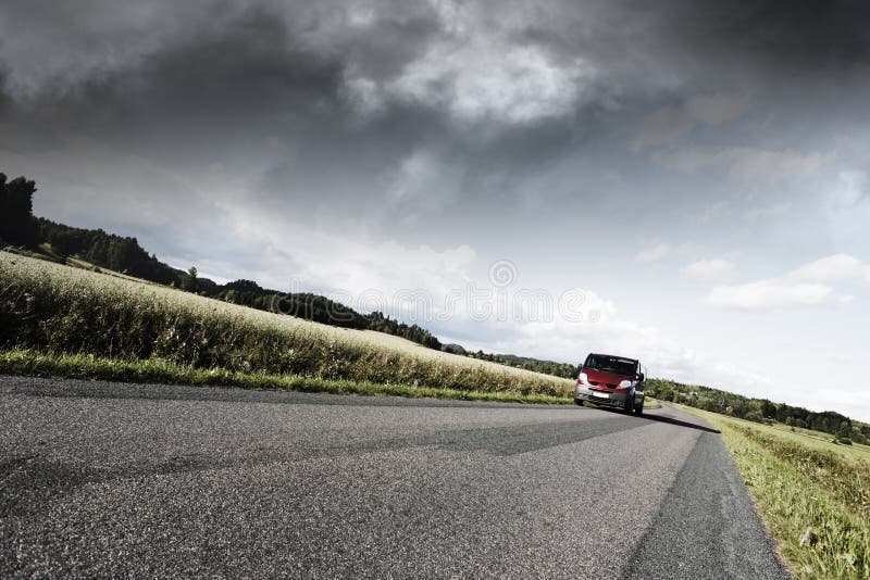 Car Driving on Lonely Country Road Stock Photo - Image of scenery ...