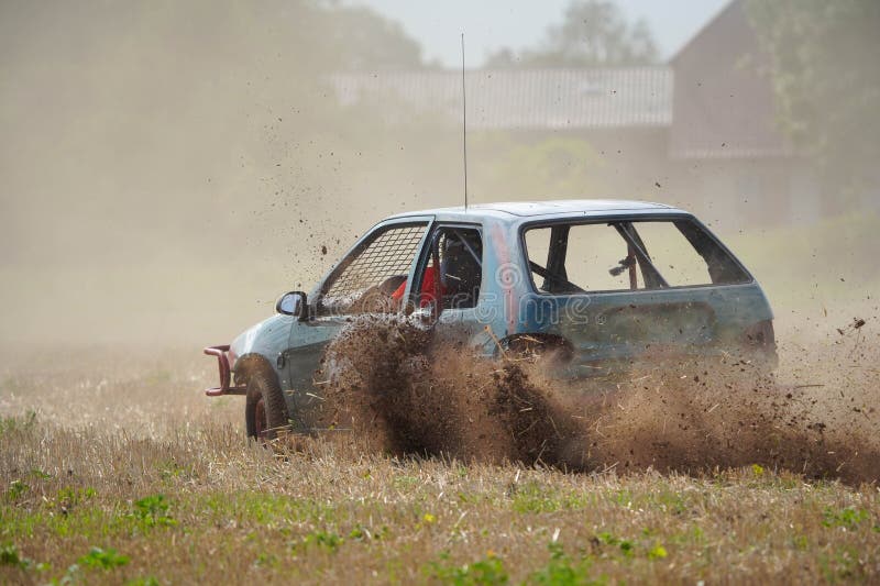 A Car is Driving through a Muddy Field Stock Image - Image of cloudy ...