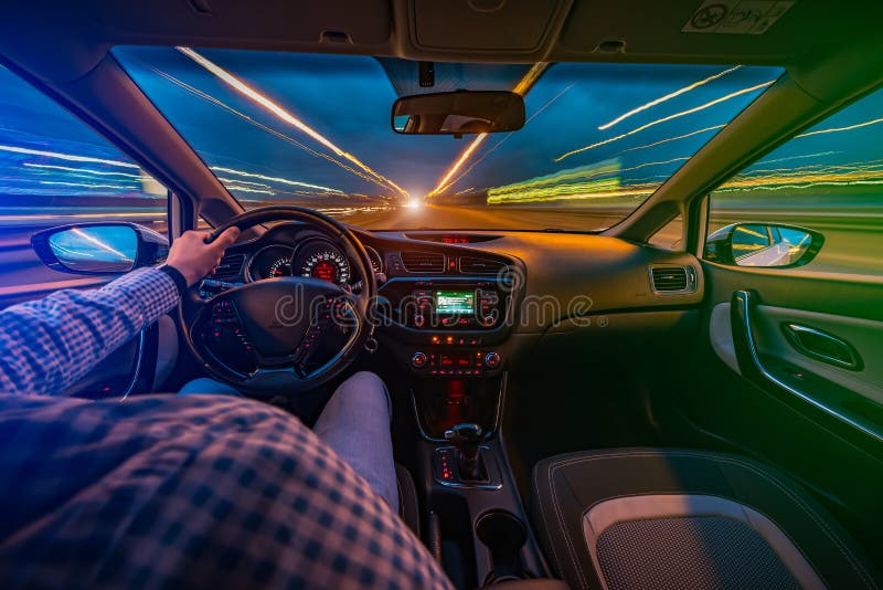 Car driving at night stock image. Image of city, dusk - 142068149