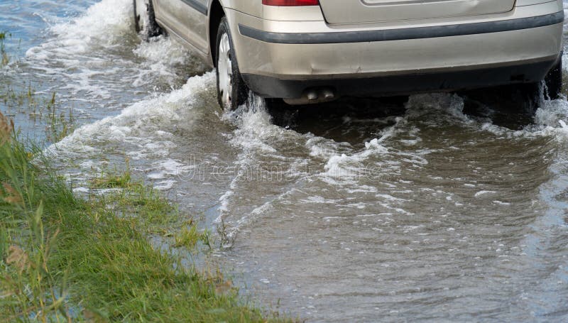 Car Driving Over Flooded Road after the Storm Stock Photo - Image of ...