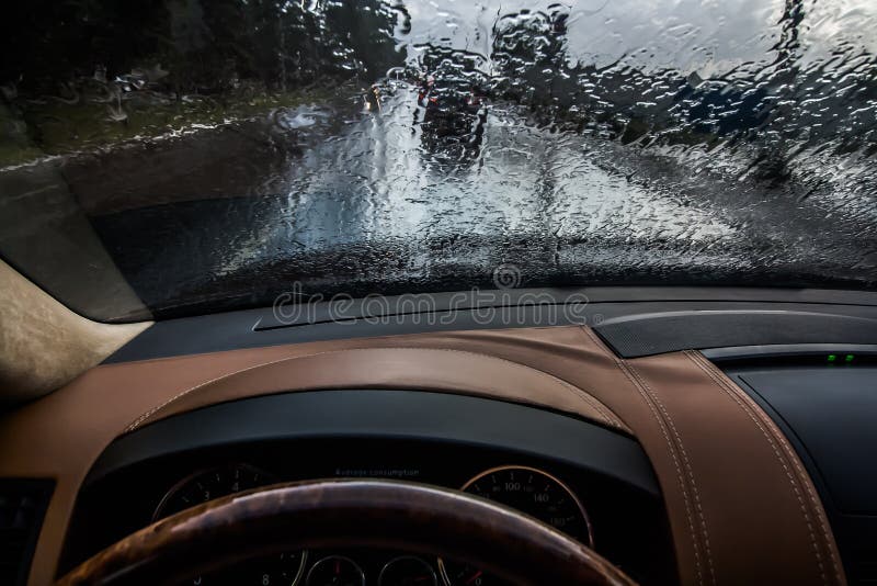 Car Driving in the Rain. View from the Inside. Raindrops on the ...