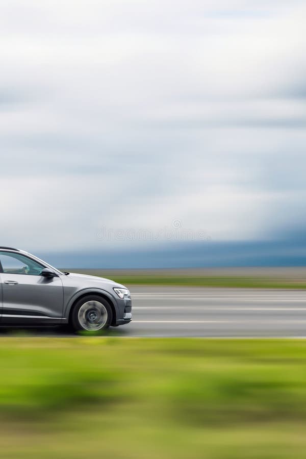 Car Driving on the Road. Gray Car in Motion, Speed Blurred Background ...