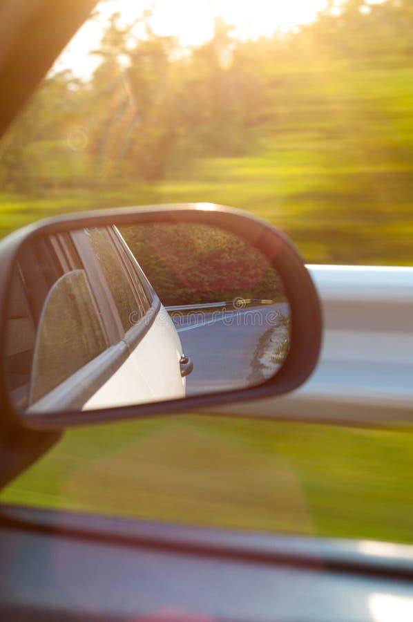 Car Driving by on a Road Near the Trees with a Mirror Stock Photo ...