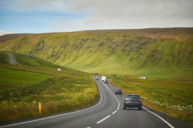 Car Driving on a Road Surrounded by Beautiful Landscape in Iceland ...