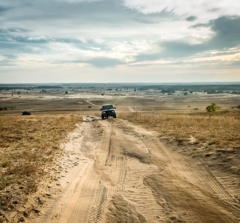 Car Driving on a Rolled Road in a Field Stock Photo - Image of scene ...