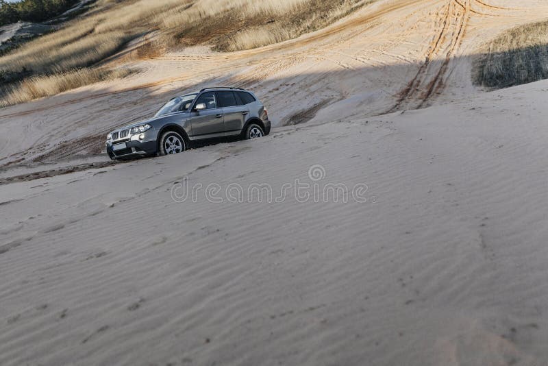 Car Driving through Sand Dune Stock Photo - Image of hill, dangerous ...