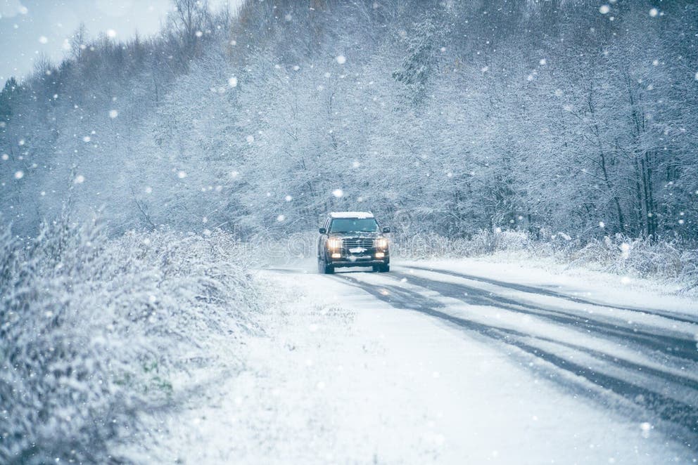 The Car is Driving on a Winter Road in a Blizzard Stock Photo - Image ...